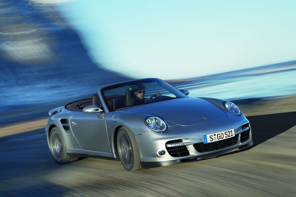 The new 911 Porsche Turbo Convertible heads for the starting line ...