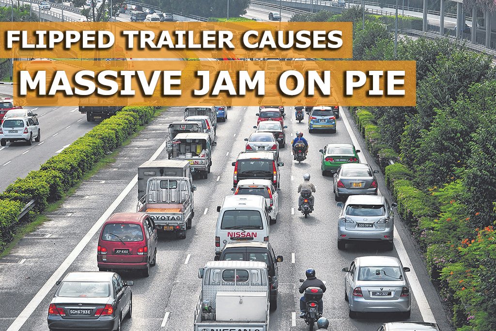 Large trailer flips on its side and causes PIE exit to be shut for 10 ...
